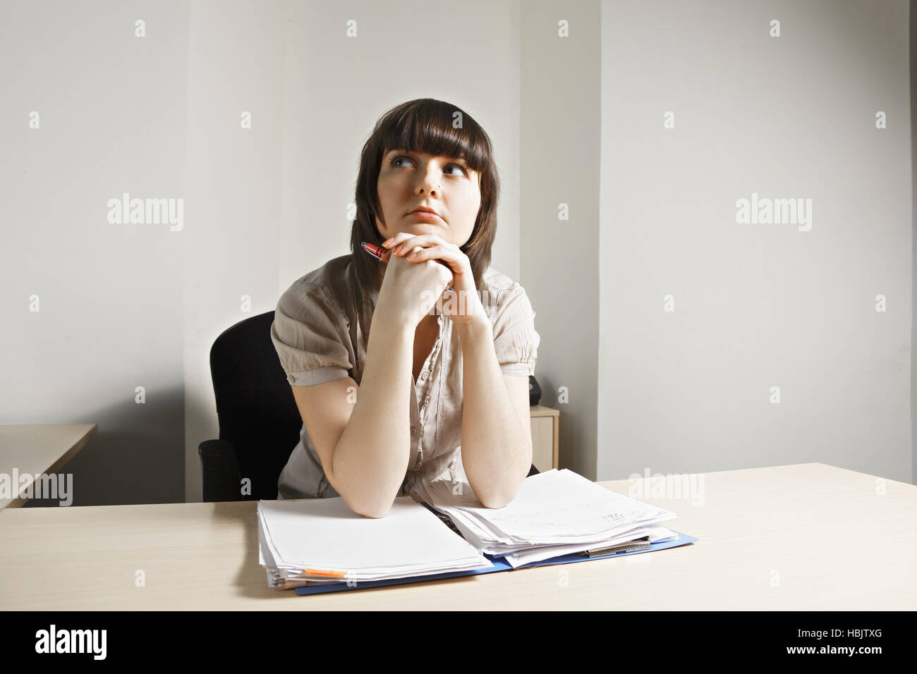 Office worker at paperwork Stock Photo - Alamy