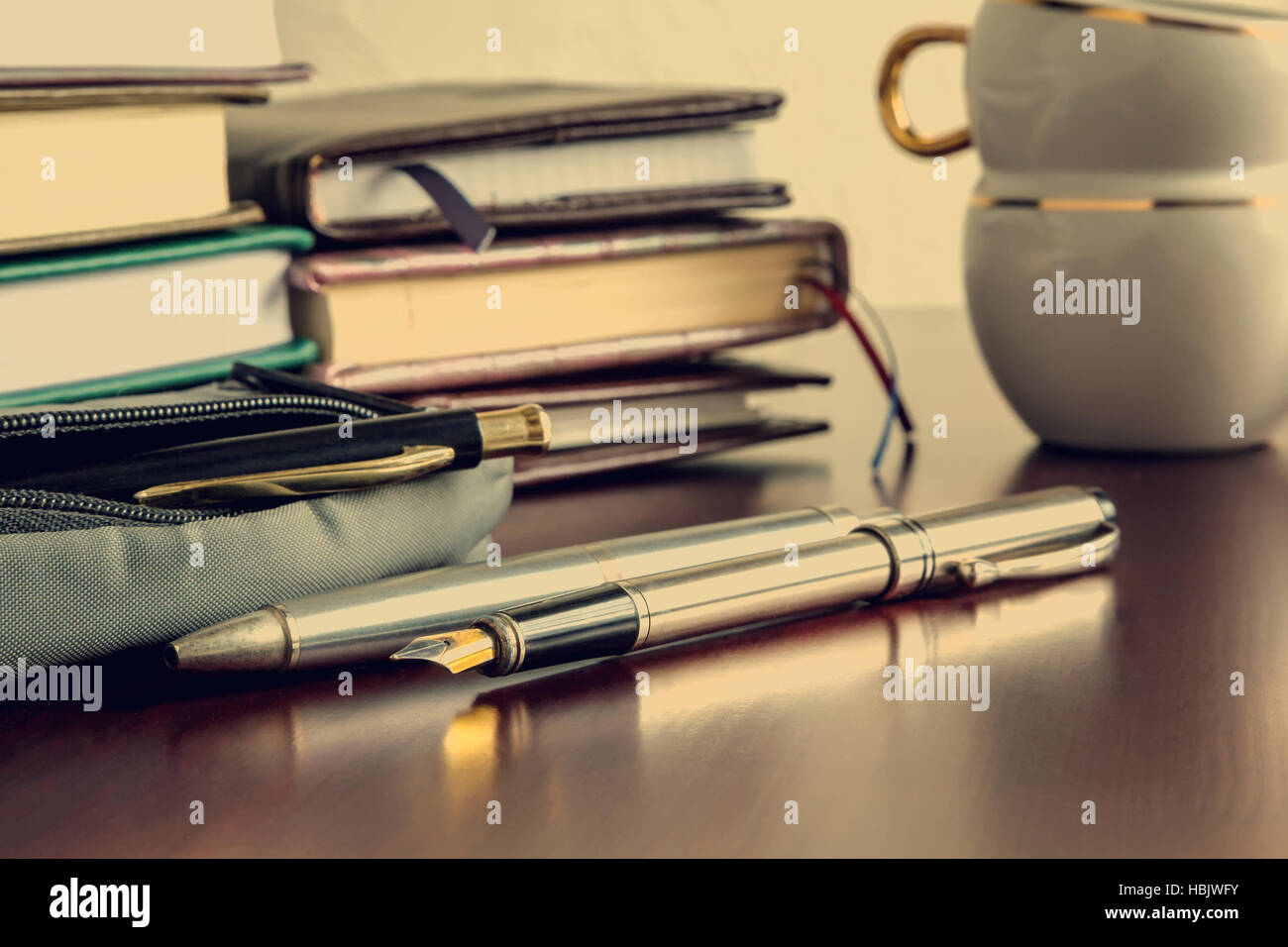 Books and pens hi-res stock photography and images - Alamy