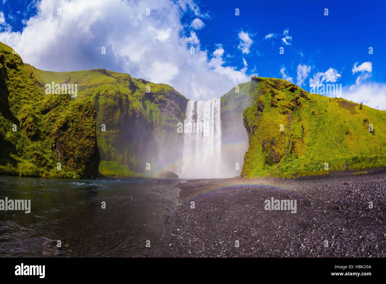 Waterfall flowing from under glacier Stock Photo - Alamy