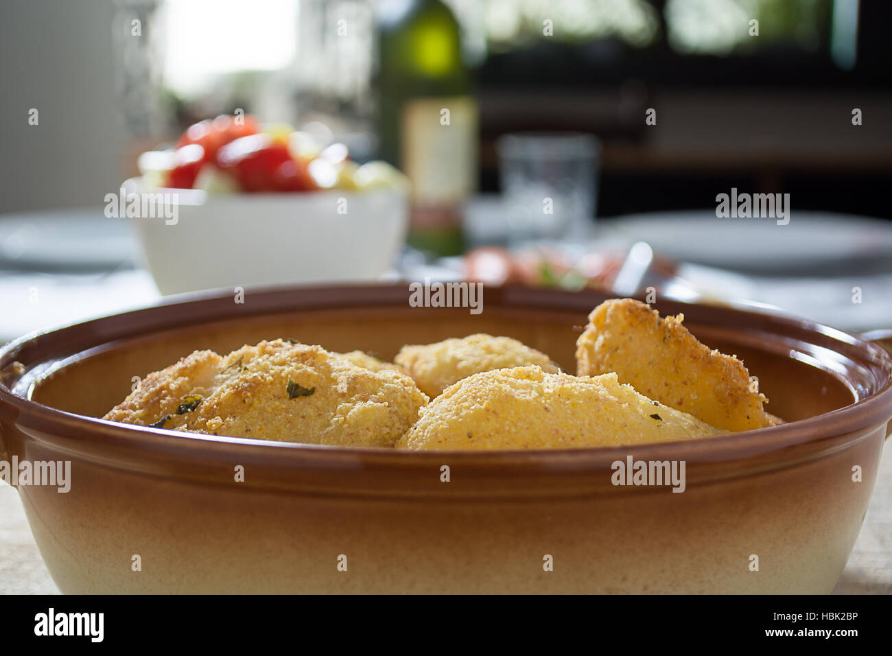Breaded potatoes in ceramic bowl Stock Photo - Alamy