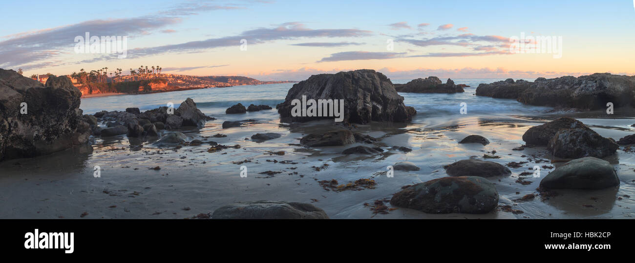 Long exposure of sunset over rocks Stock Photo - Alamy