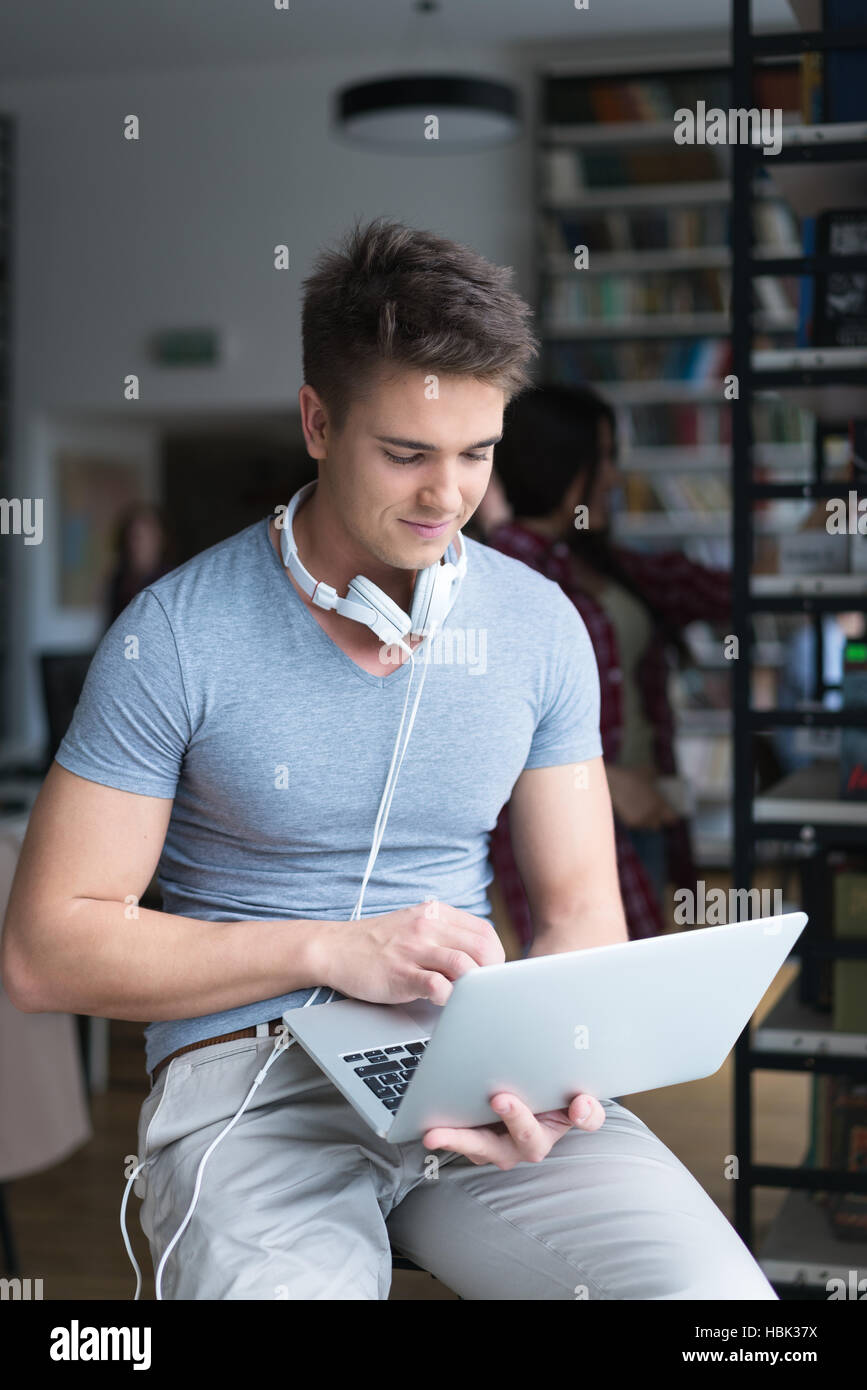 Man in library Stock Photo - Alamy
