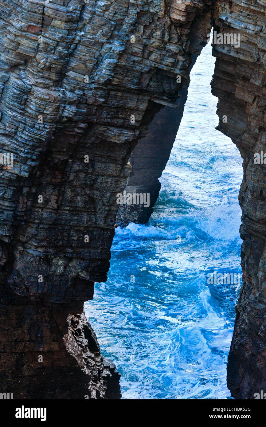 Natural arches on beach Stock Photo - Alamy