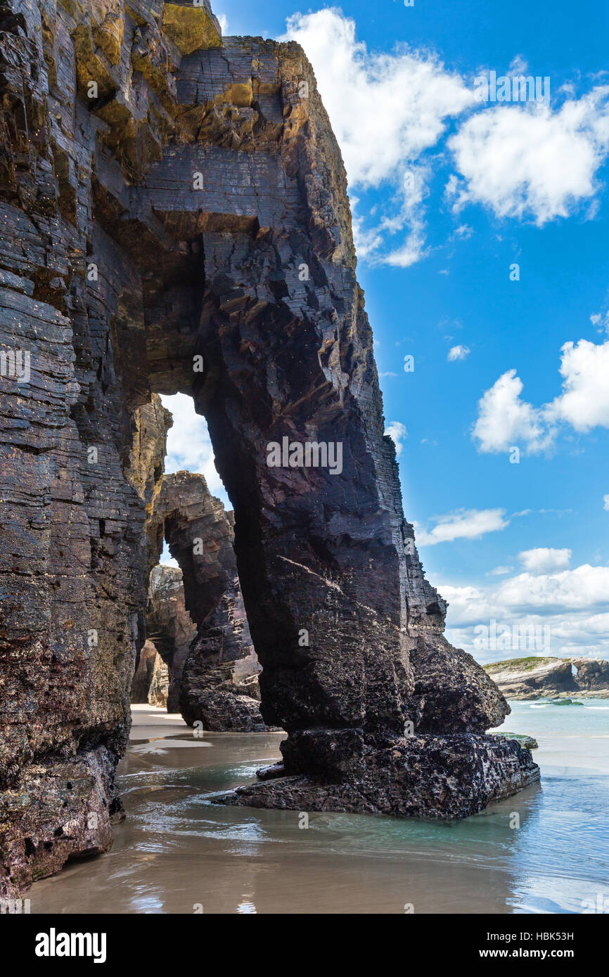 Natural arches on beach Stock Photo - Alamy