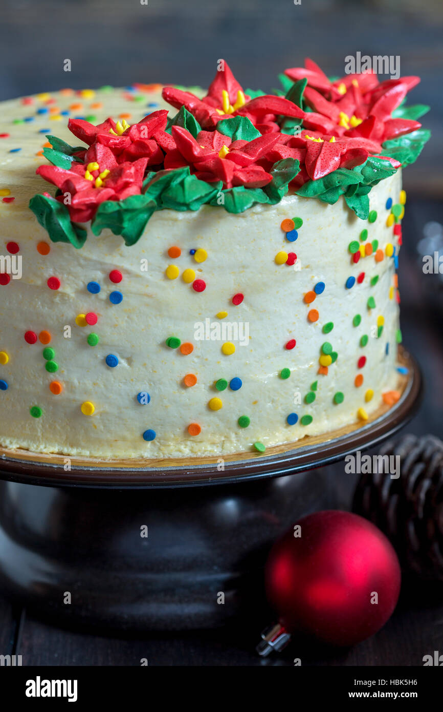 Christmas cake with red flowers Stock Photo - Alamy