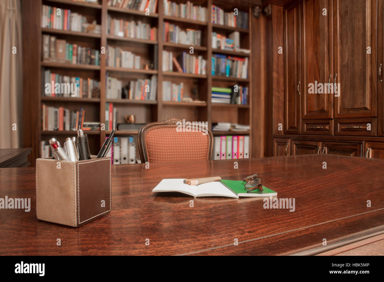 Study table with pens and books Stock Photo - Alamy