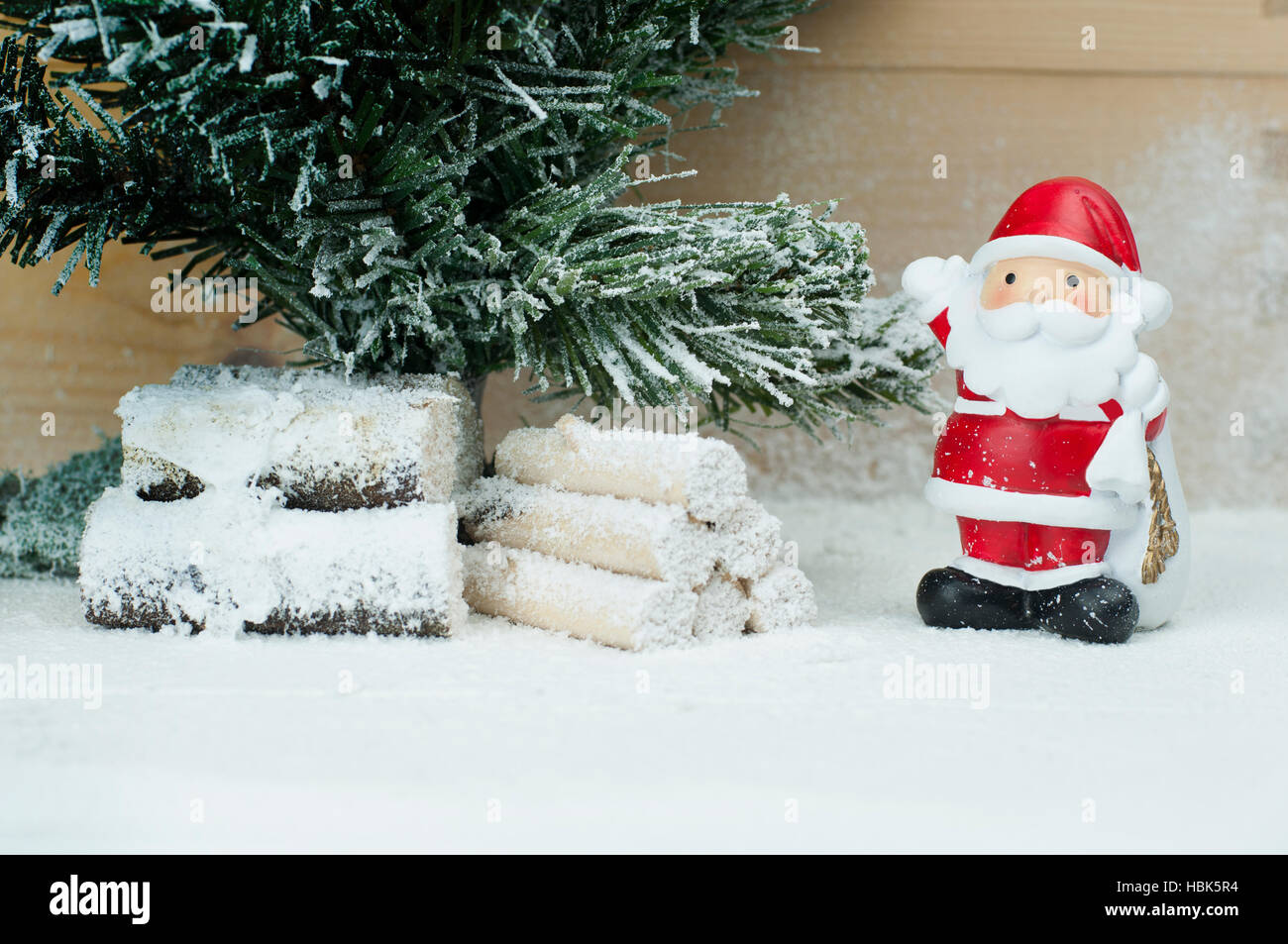 A clay figurine of Santa Claus and Christmas tree. Figure Santa claus ...