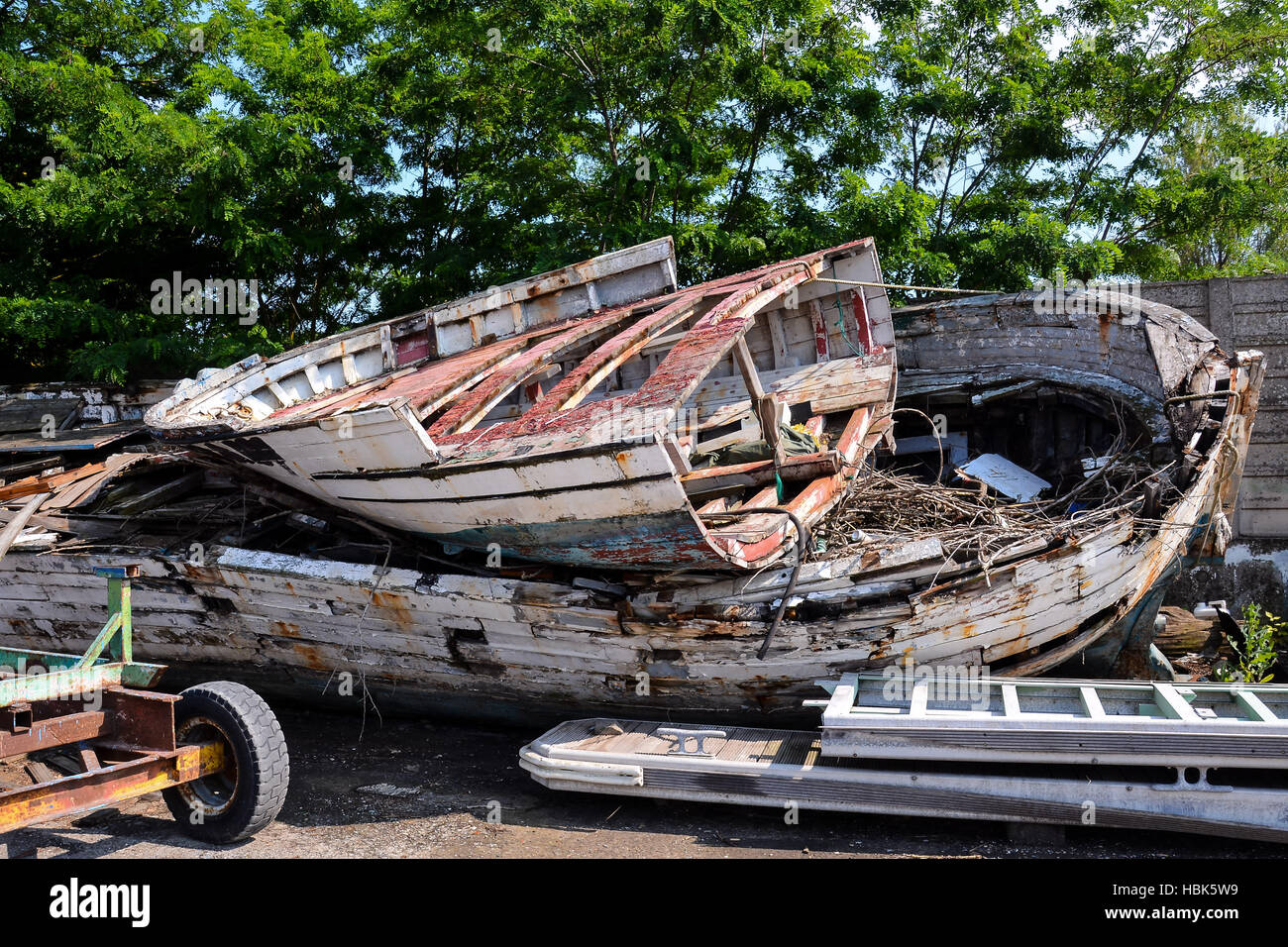 Old and broken wooden boat stranded Stock Photo - Alamy