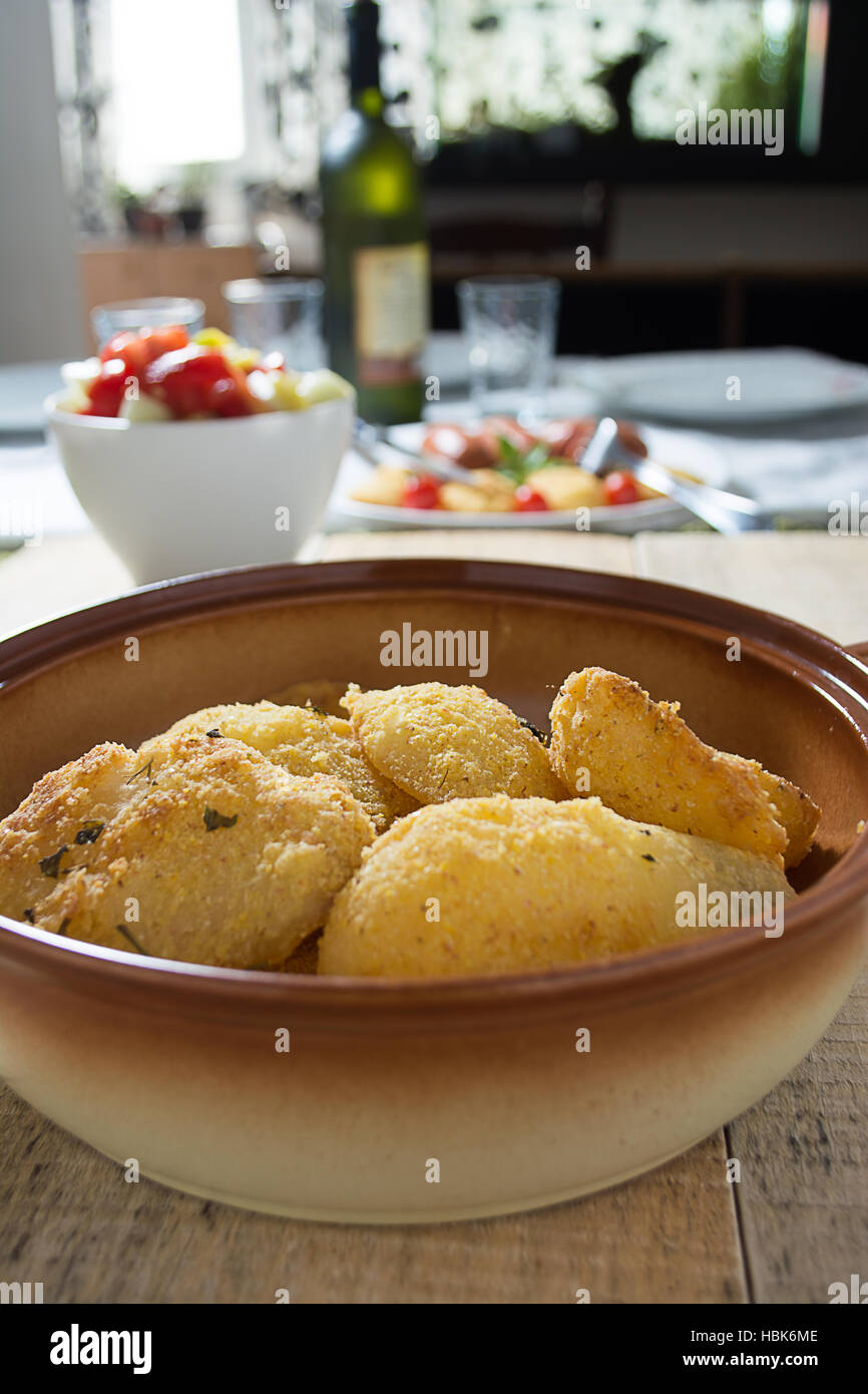 Breaded potatoes in ceramic bowl Stock Photo - Alamy