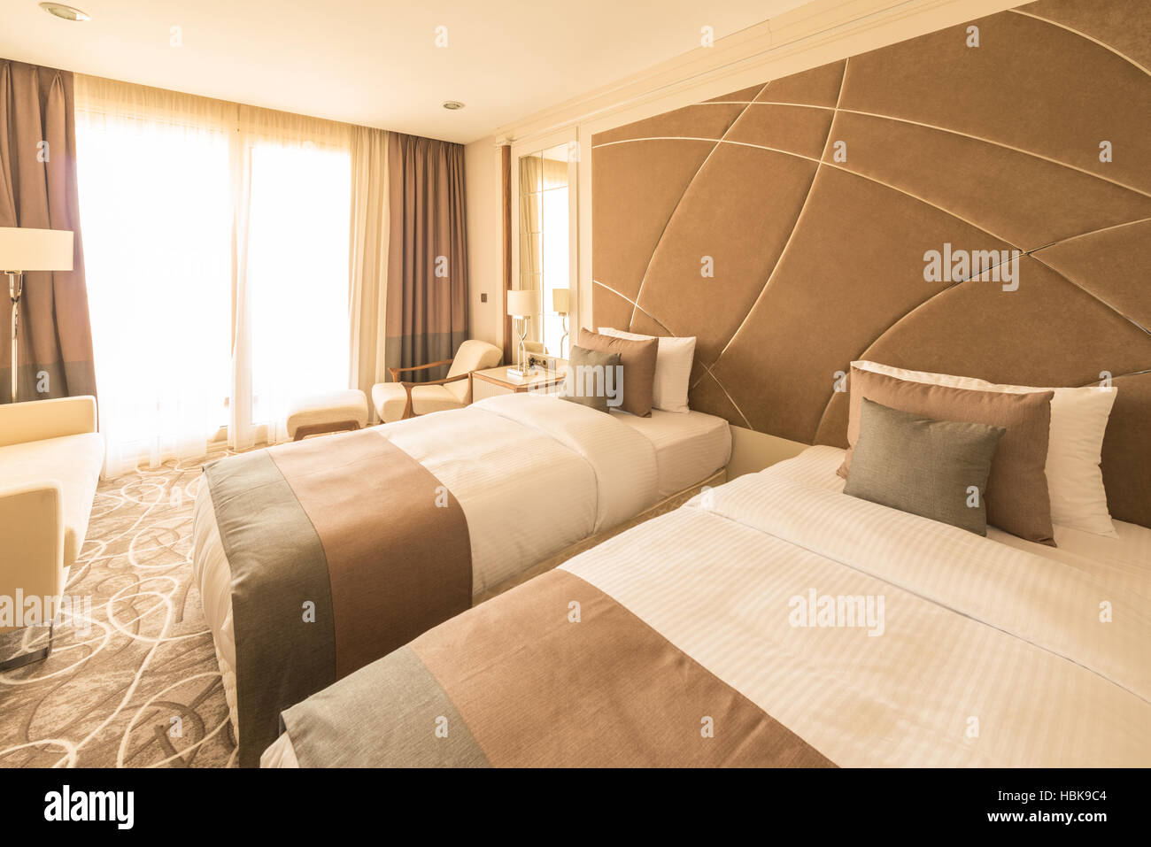 Modern hotel room with big bed Stock Photo - Alamy