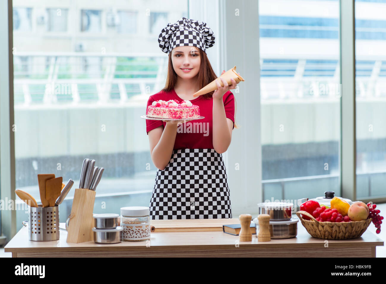 Young housewife baking cake in kitchen Stock Photo - Alamy