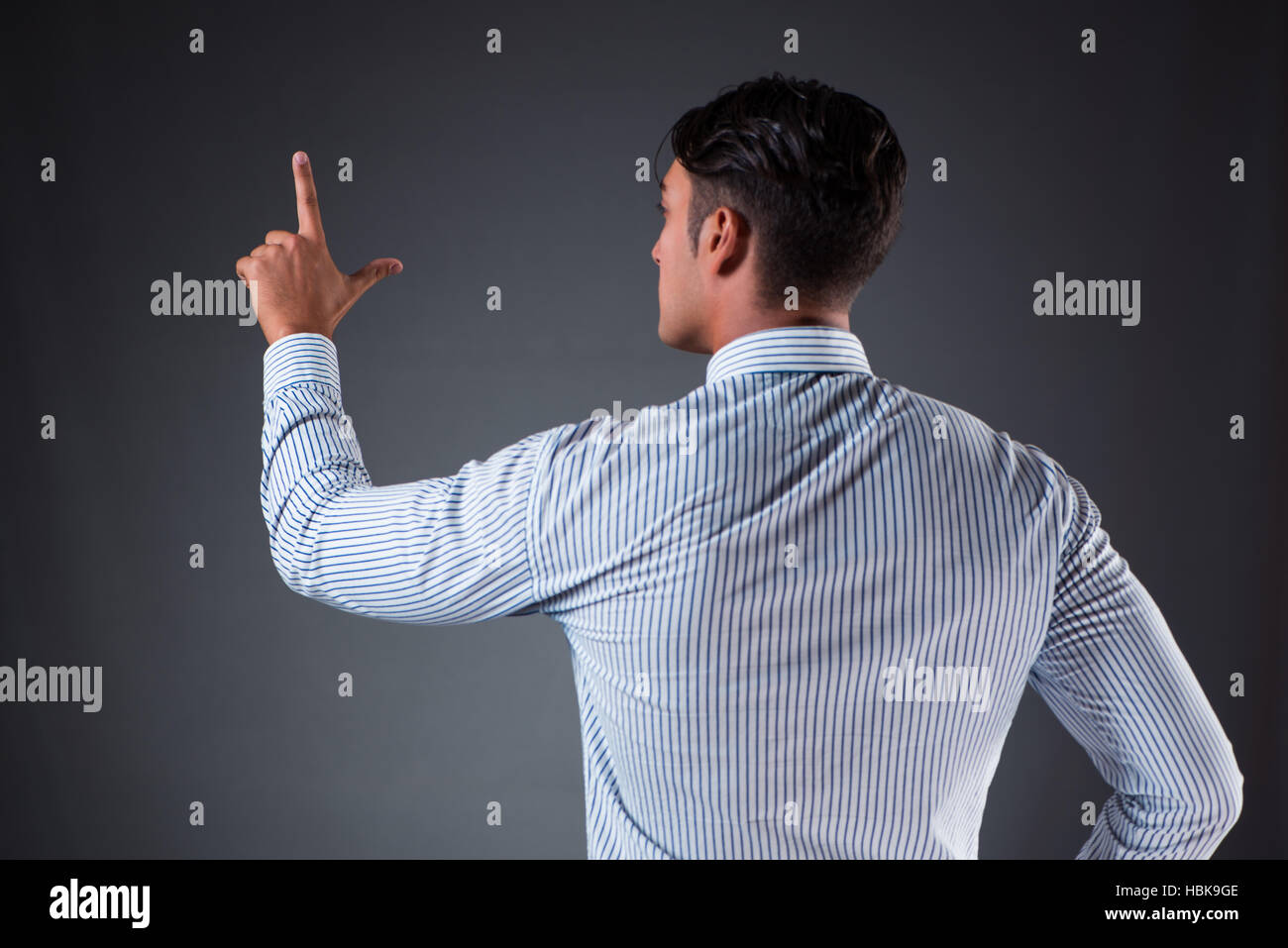 Handsome businessman pressing virtual buttons Stock Photo - Alamy