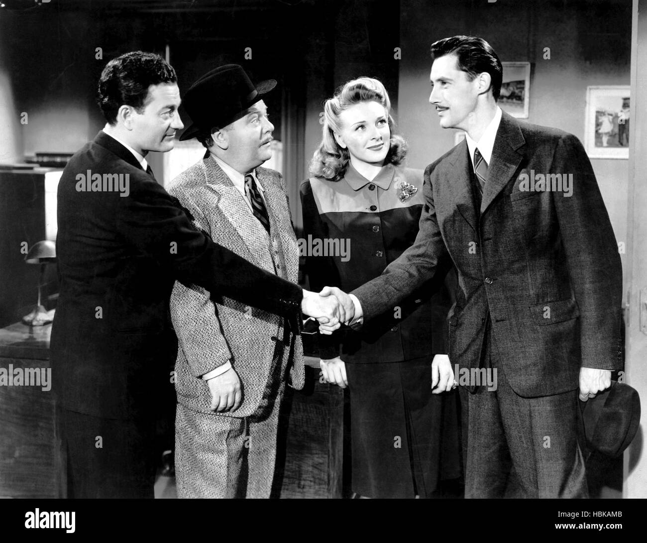 CAPTIVE WILD WOMAN, from left, Milburn Stone, Lloyd Corrigan, Evelyn ...