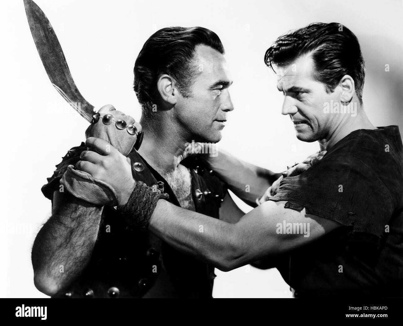 CAPTIVE WOMEN, from left, Ron Randell, Robert Clarke, 1952 Stock Photo ...