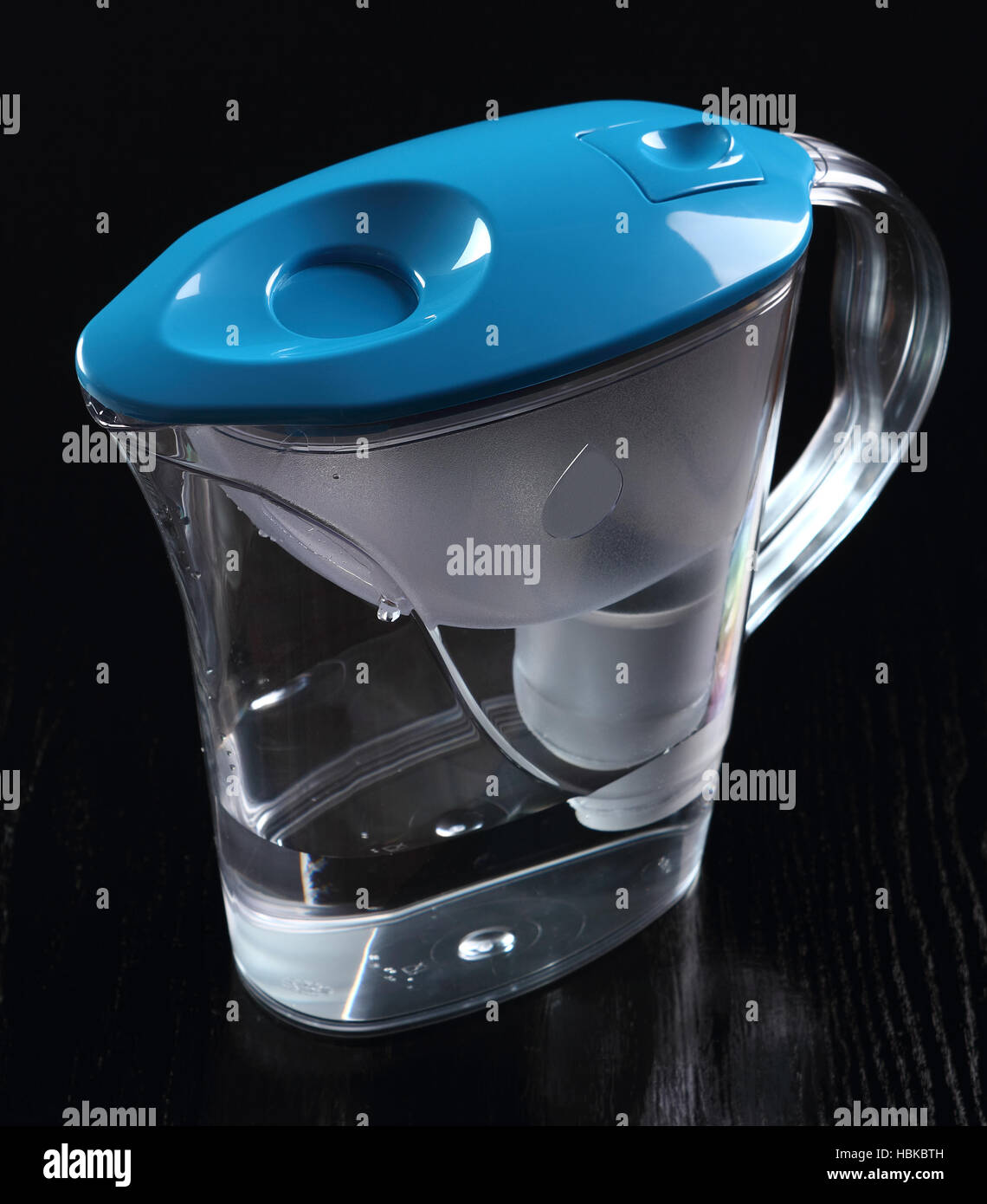 Water filter jug at black background Stock Photo - Alamy