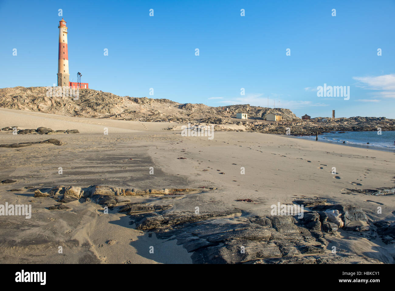 Lighthouse in front of beach Stock Photo - Alamy