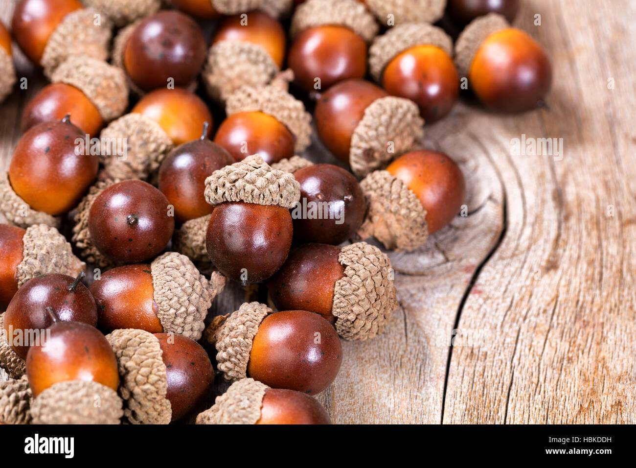 Pile of acorn decorations on rustic wood Stock Photo - Alamy