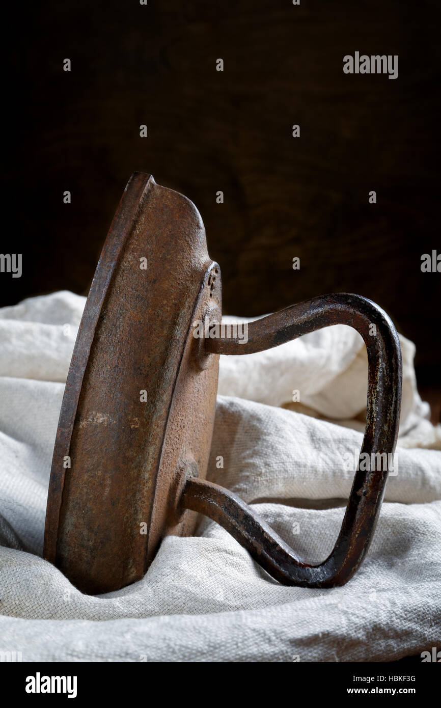 Old vintage iron gray cloth on table Stock Photo - Alamy