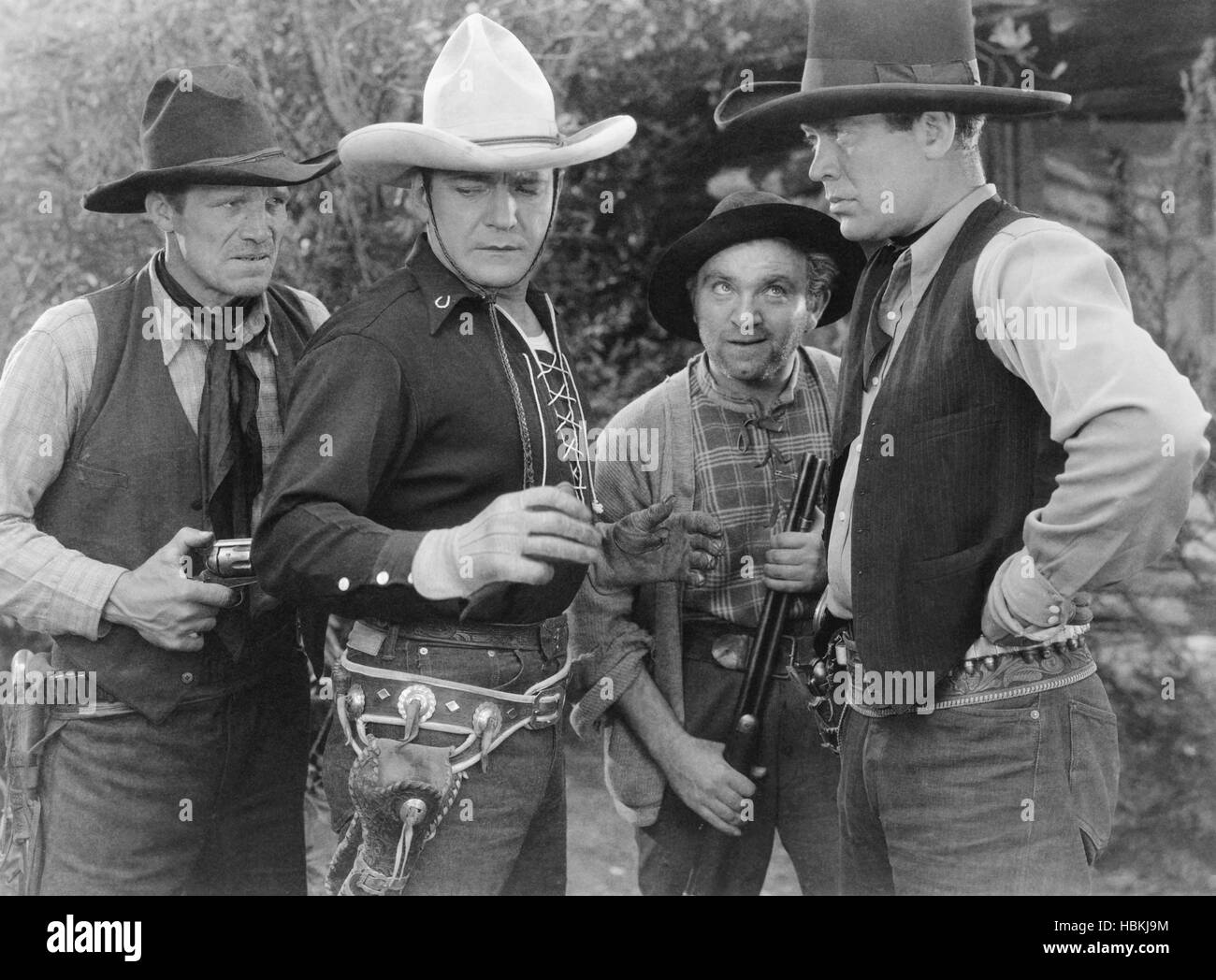 THE CRIMSON TRAIL, from left: Bob Kortman, Buck Jones, Bud Osborne ...
