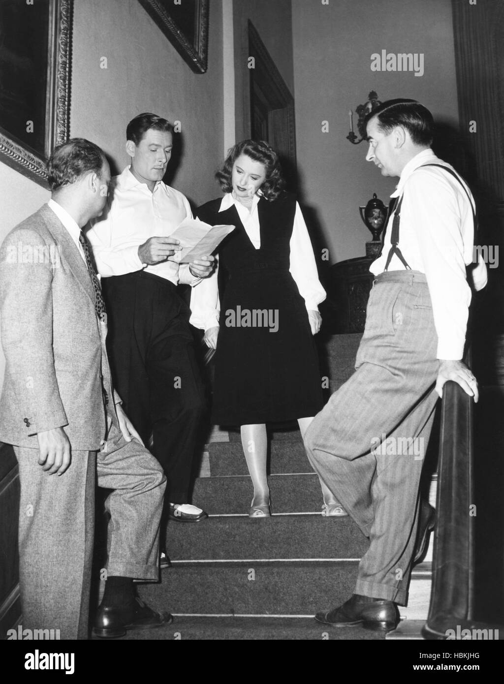 CRY WOLF, center, from left, Errol Flynn, Barbara Stanwyck, director ...