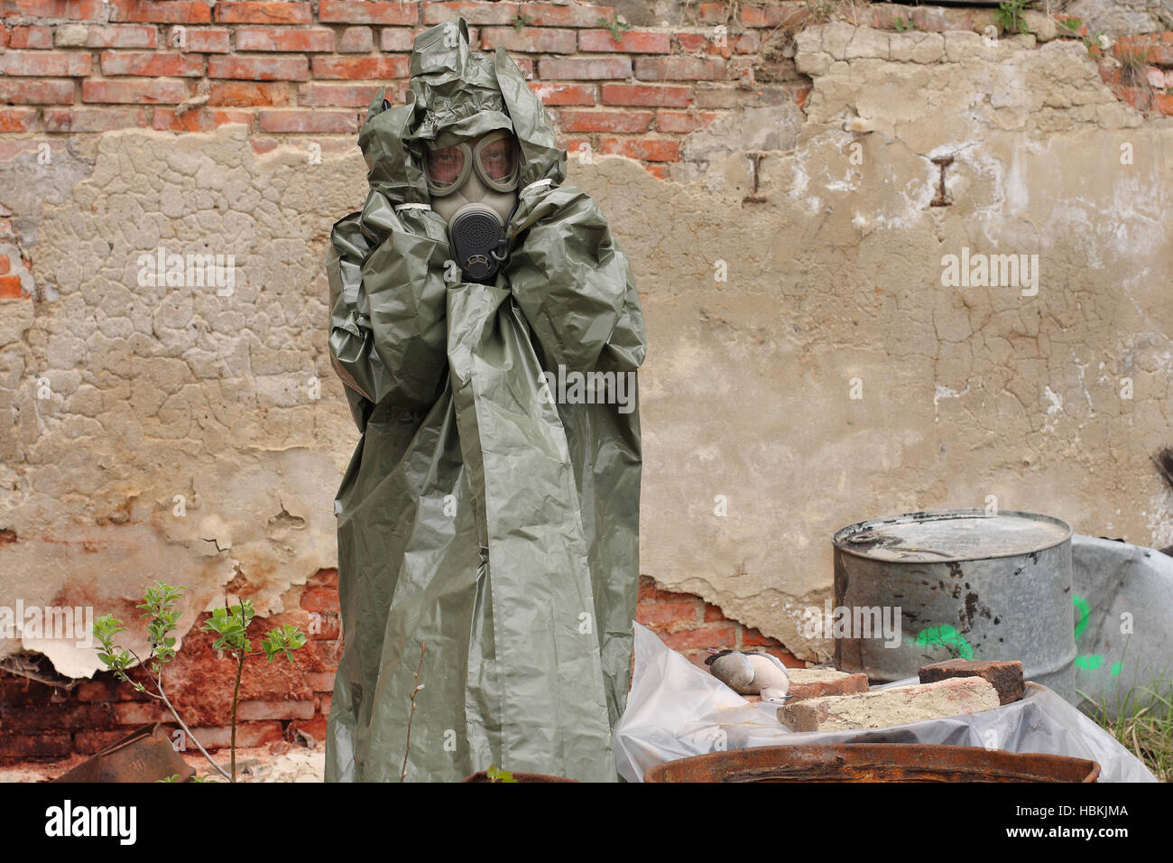 Man with gas mask and green military clothes after chemical disaster ...