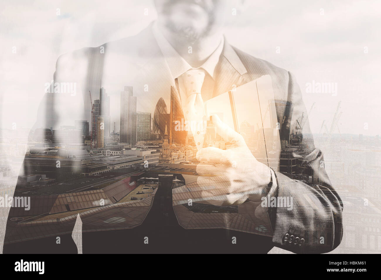 Double exposure of success businessman holding digital tablet computer ...