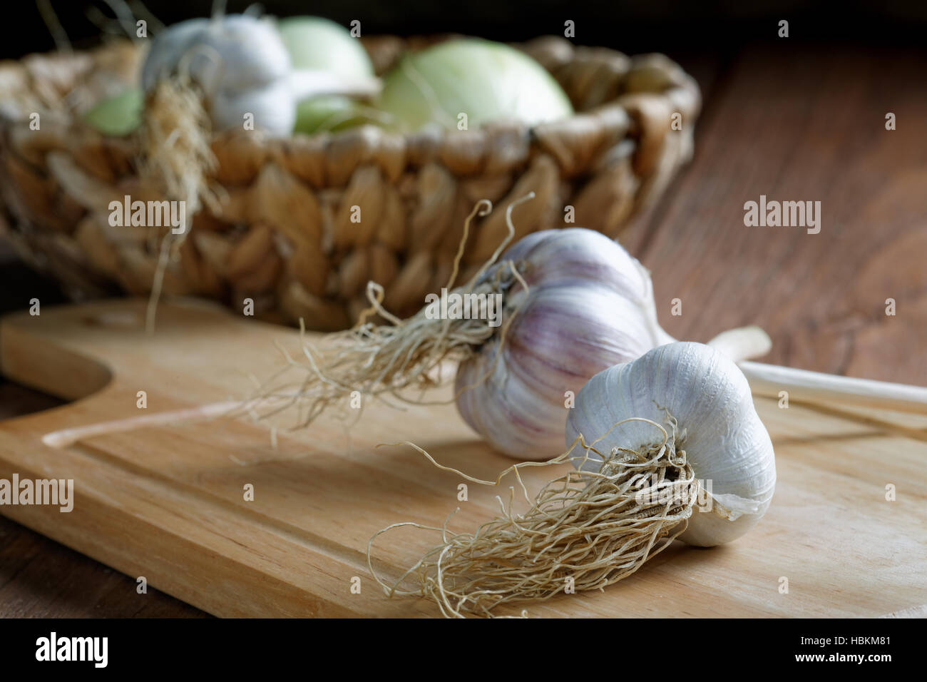 head of garlic on the table rustic Stock Photo - Alamy
