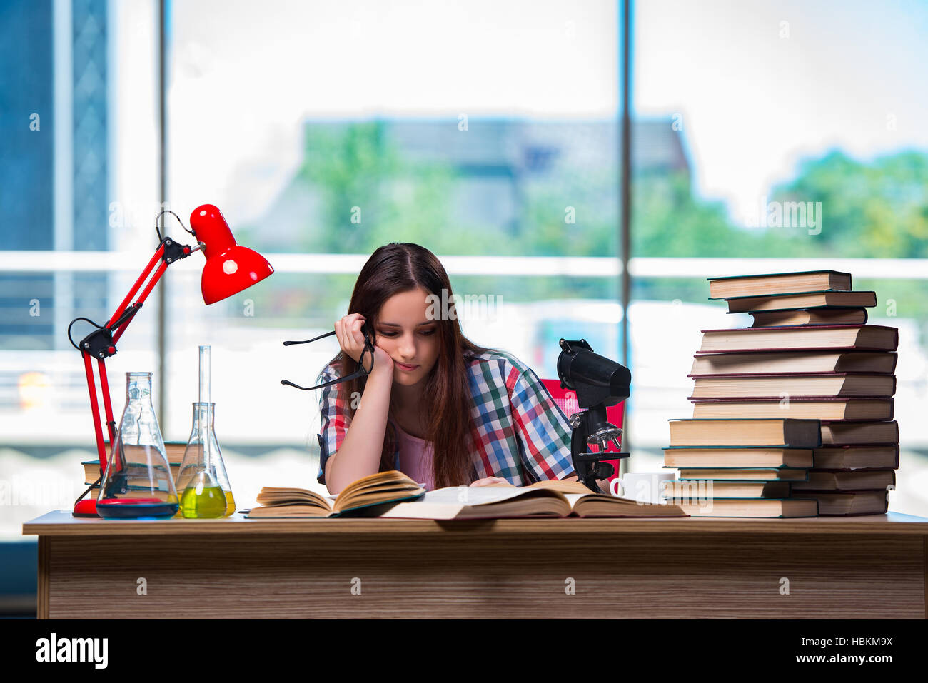 Sad student preparing for chemistry exams Stock Photo - Alamy