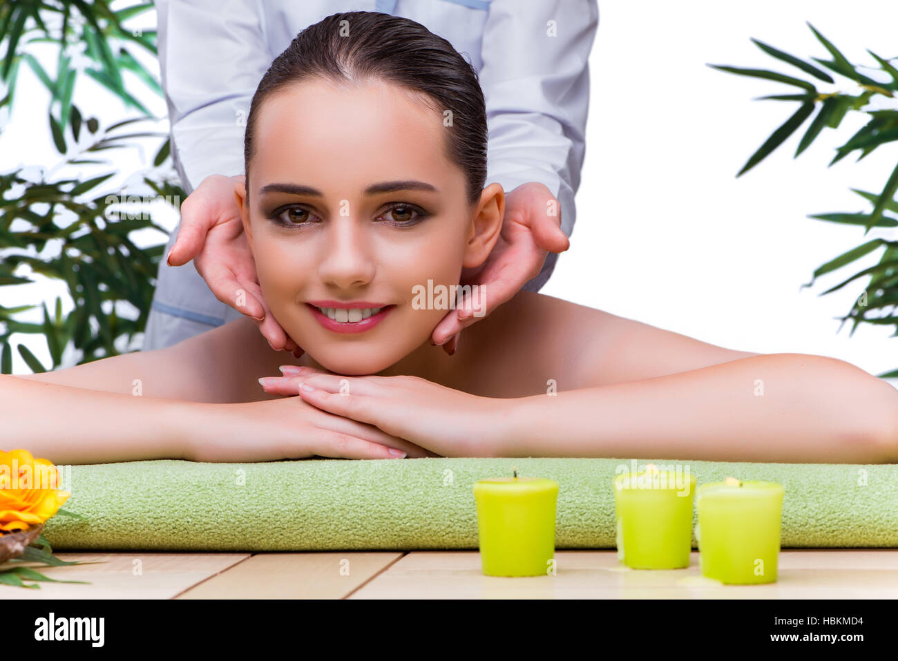 Woman during massage session in spa salon Stock Photo - Alamy