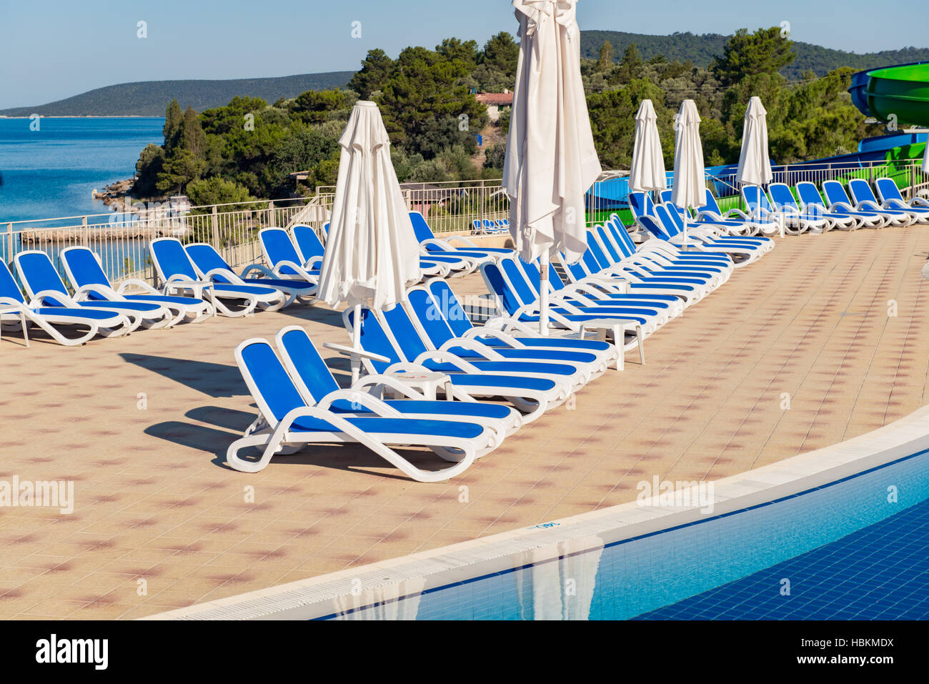Swimming pool on bright summer day Stock Photo - Alamy