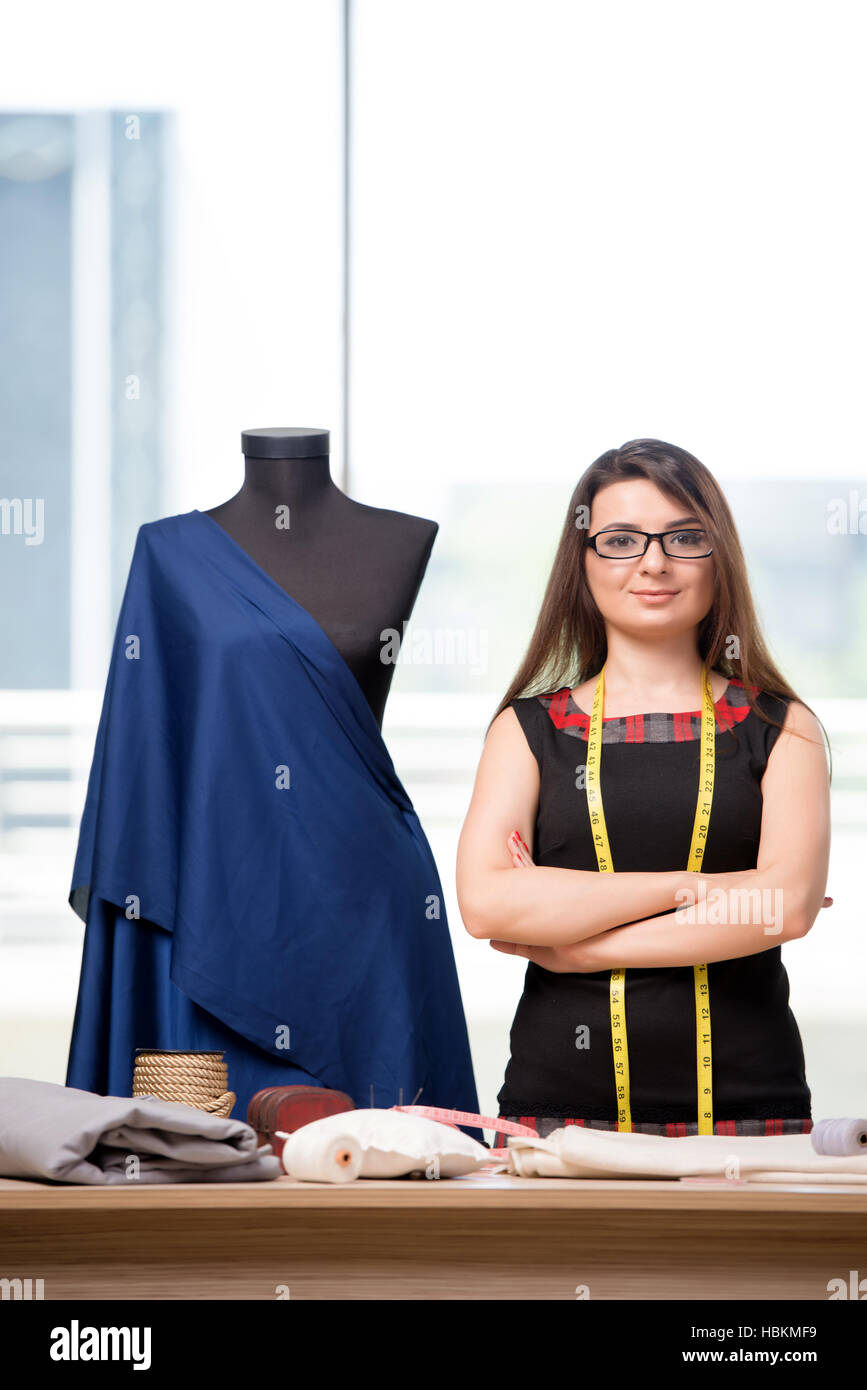 Woman tailor working on new clothing Stock Photo - Alamy
