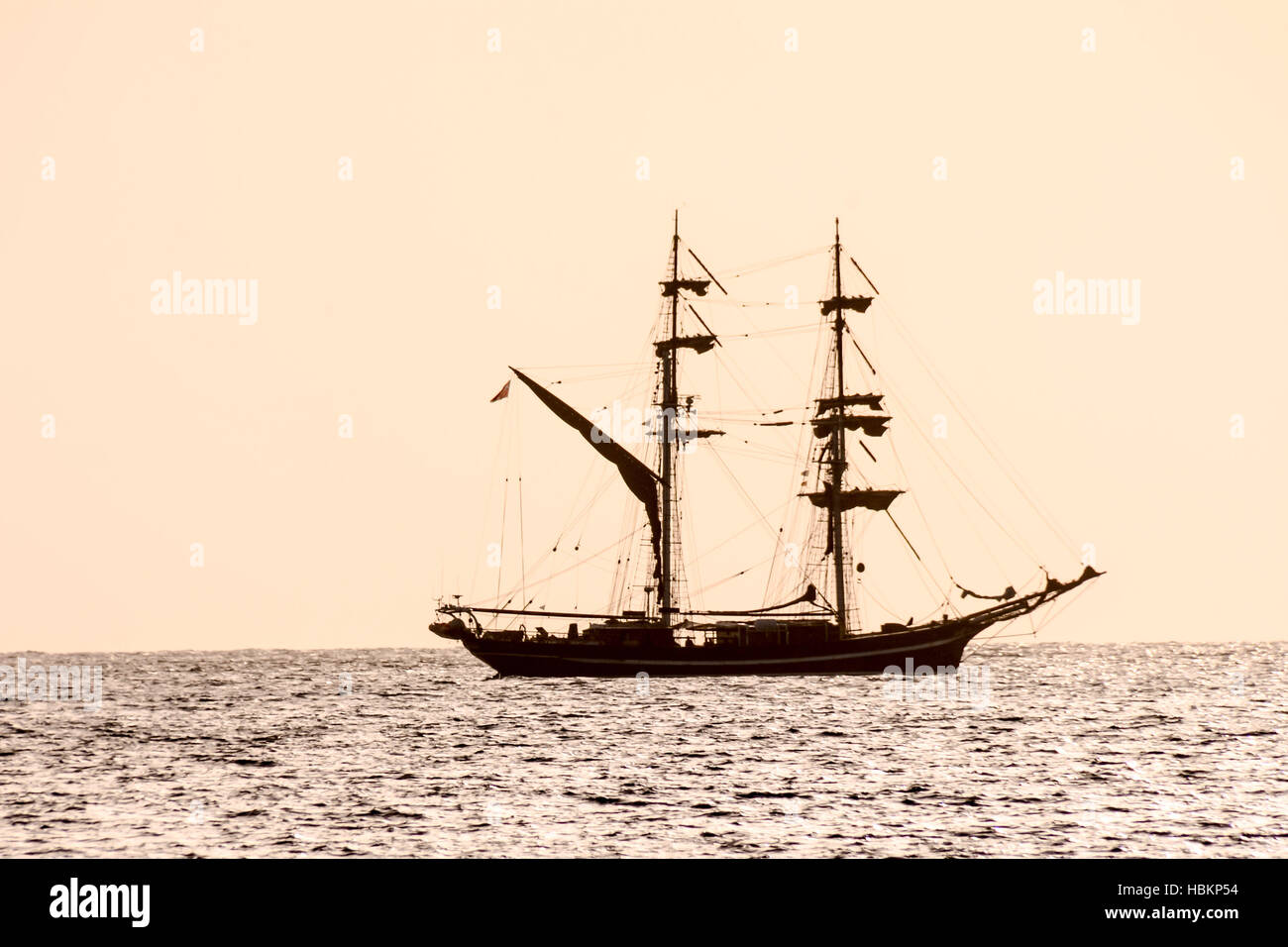 Sail Boat Silhouette at Sunset Stock Photo - Alamy