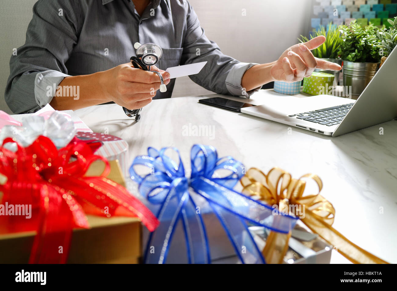 Gift giving,medical doctor Hand with credit card and hand with gift ...