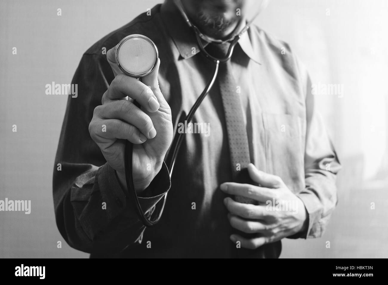 smart medical doctor holding stethoscope front view,filter effect,black ...