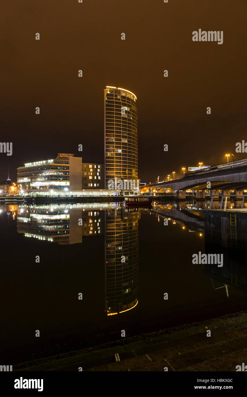The Obel Tower and River Lagan at night. Belfast, Northern Ireland ...