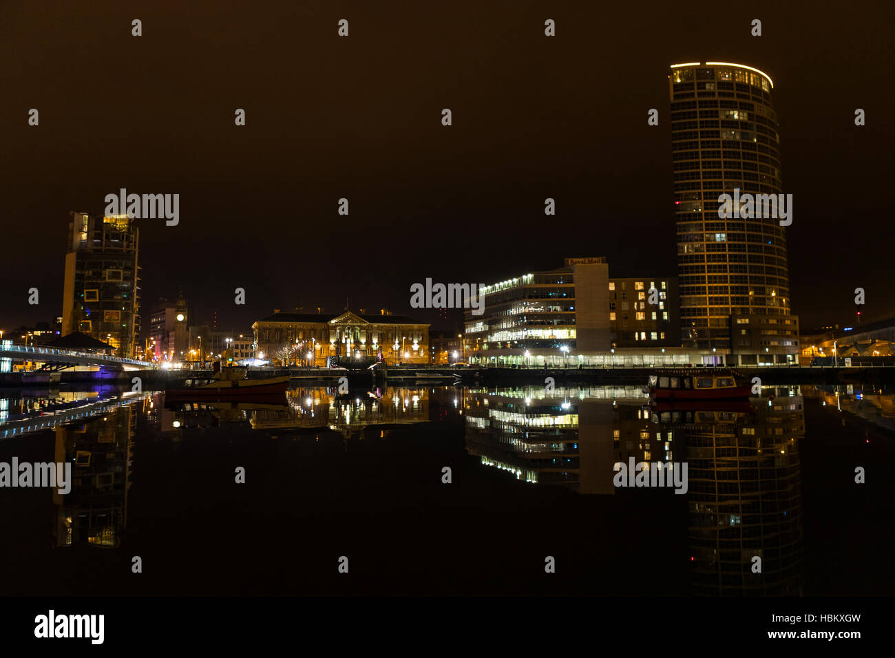 The Obel Tower and River Lagan at night. Belfast, Northern Ireland ...