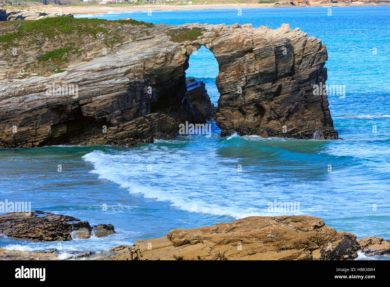 Natural arches on beach Stock Photo - Alamy