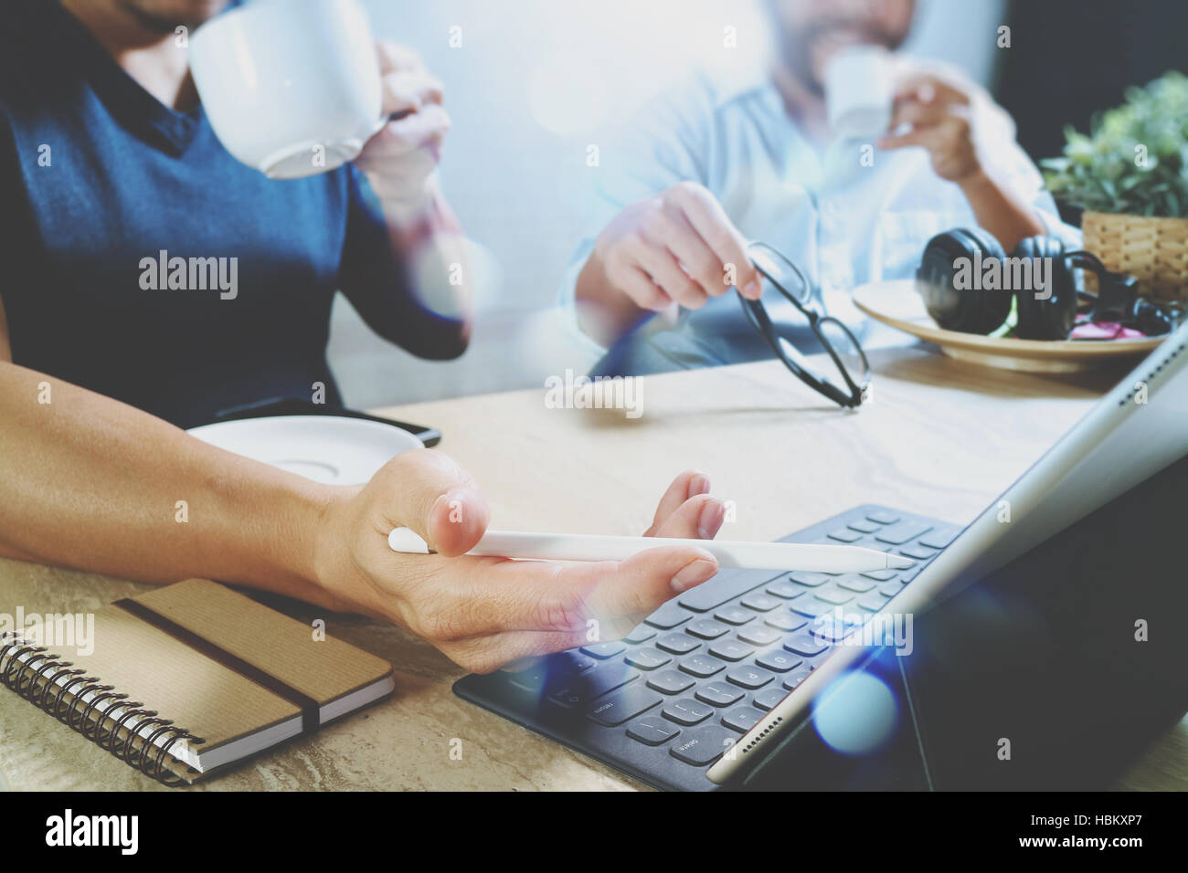 co working website designers working at office and holding a cup of ...