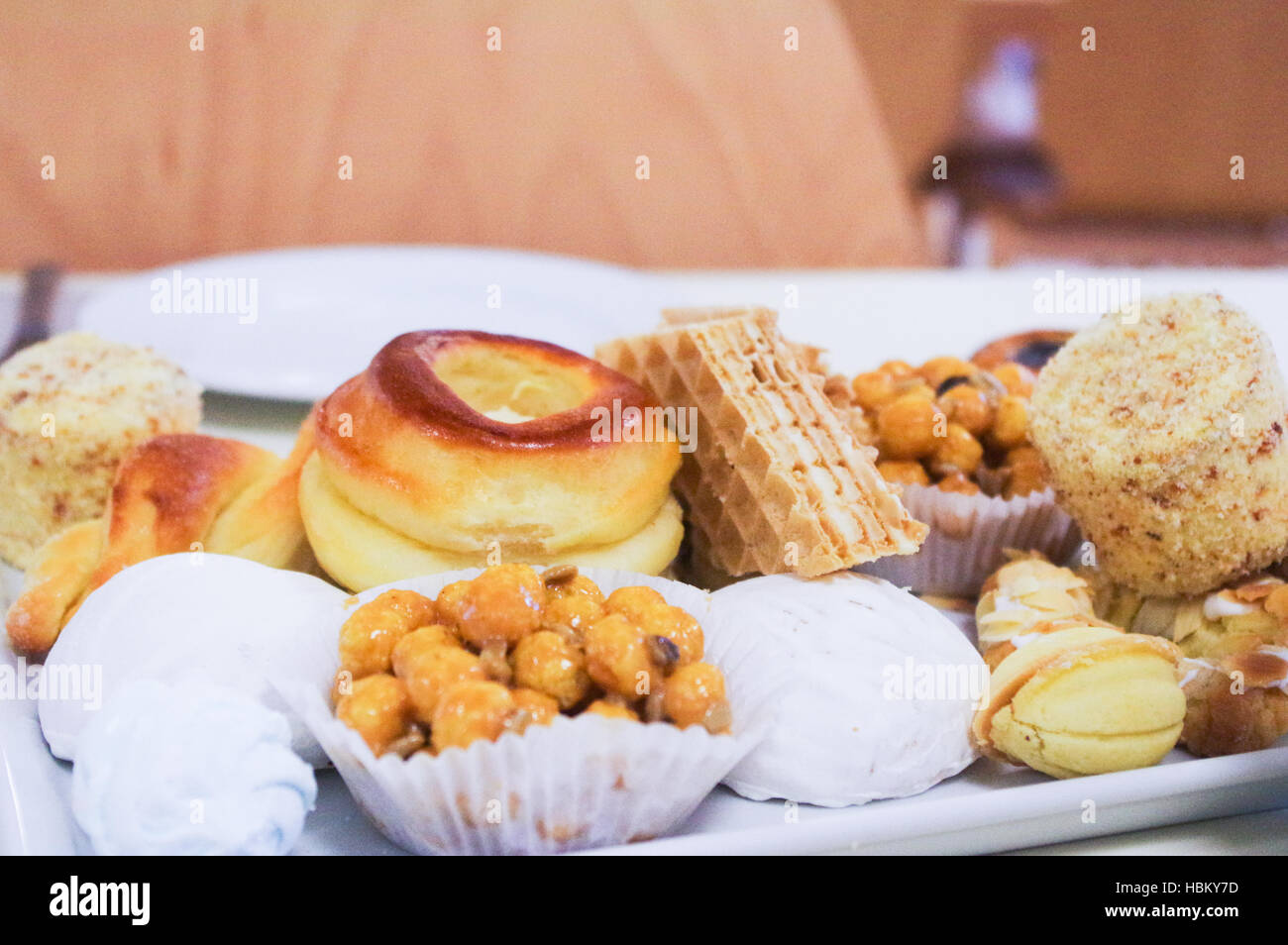 different types of sweet pastries on plates Stock Photo - Alamy