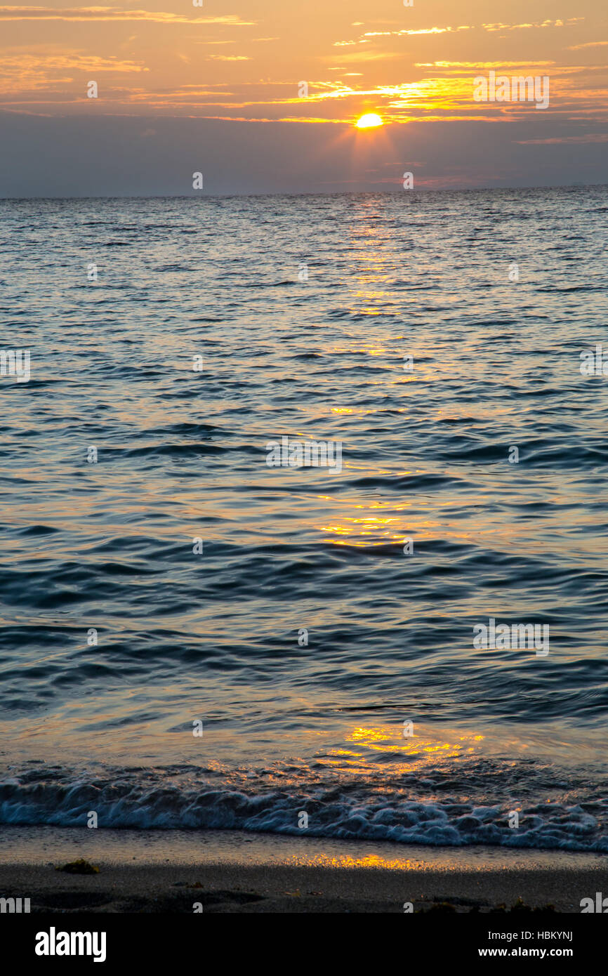Sunset at the beach Stock Photo - Alamy