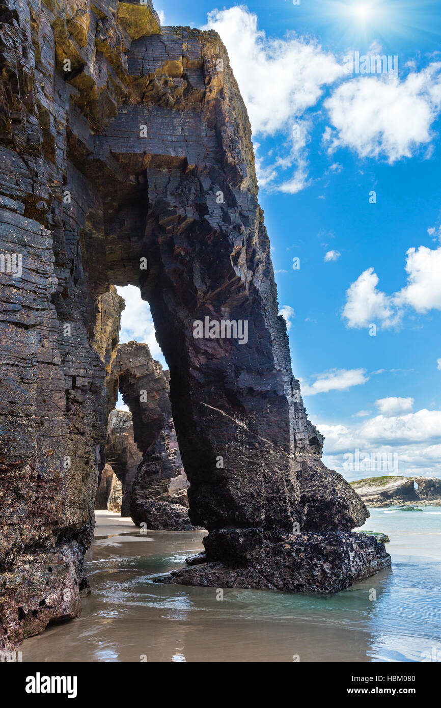 Natural arches on sunshiny beach Stock Photo - Alamy