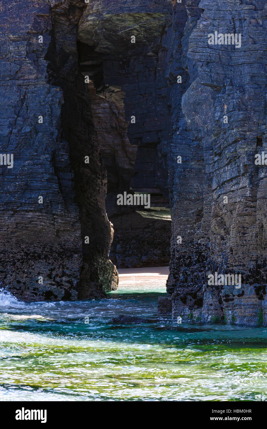 Natural arches on beach Stock Photo - Alamy