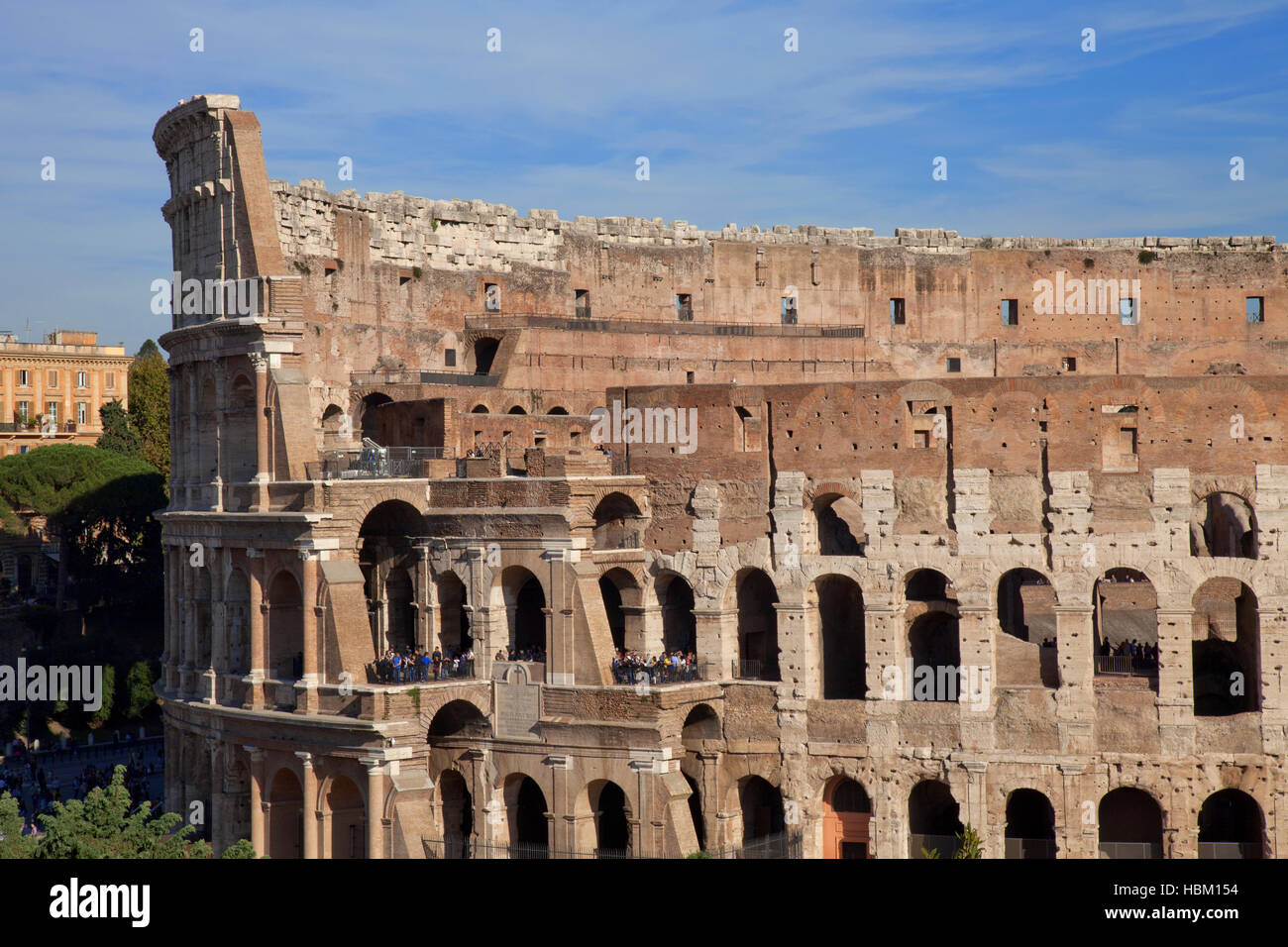 Rome, Colosseum, amphitheatre exterior with tourists on viewing ...