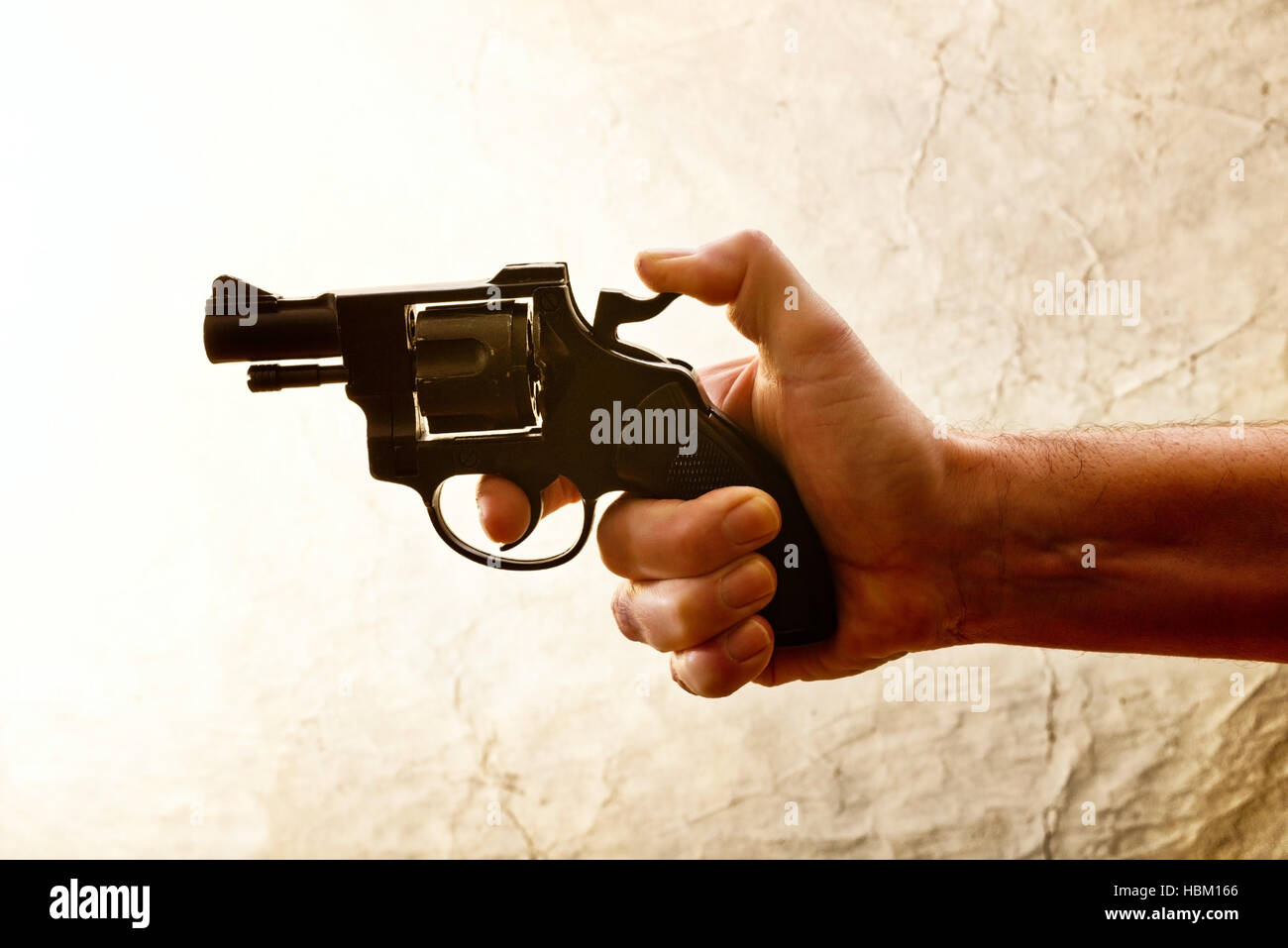 Pistol revolver in hand gangster hi-res stock photography and images ...