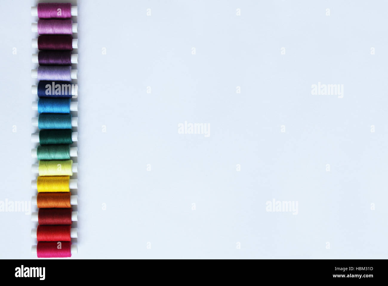 Sewing colored threads Stock Photo - Alamy
