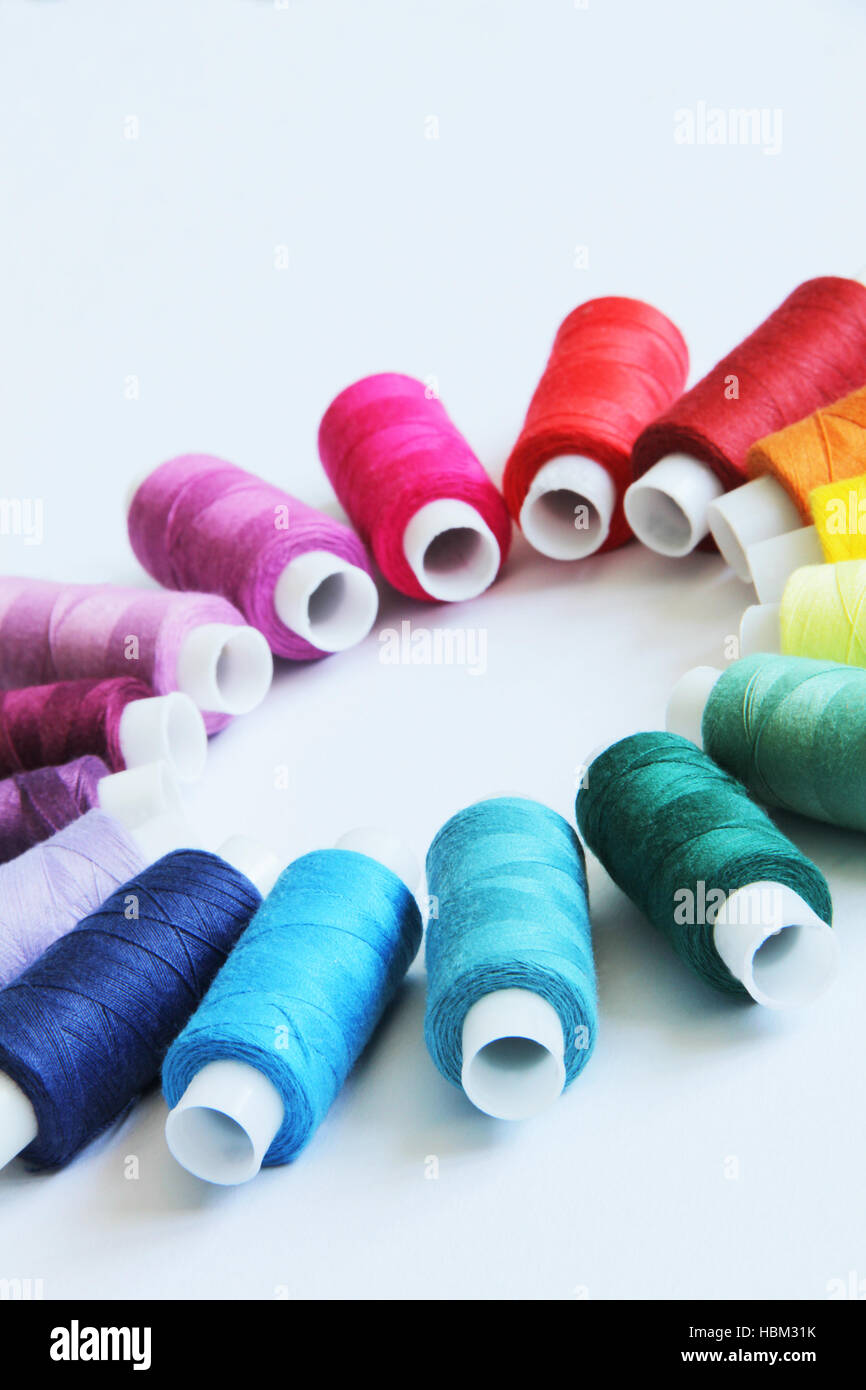 Sewing colored threads Stock Photo - Alamy