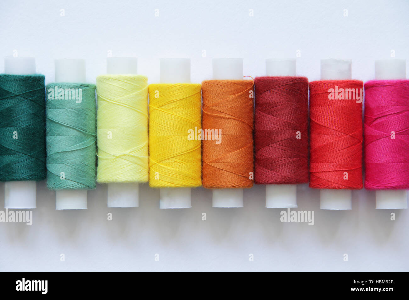 Sewing colored threads Stock Photo - Alamy