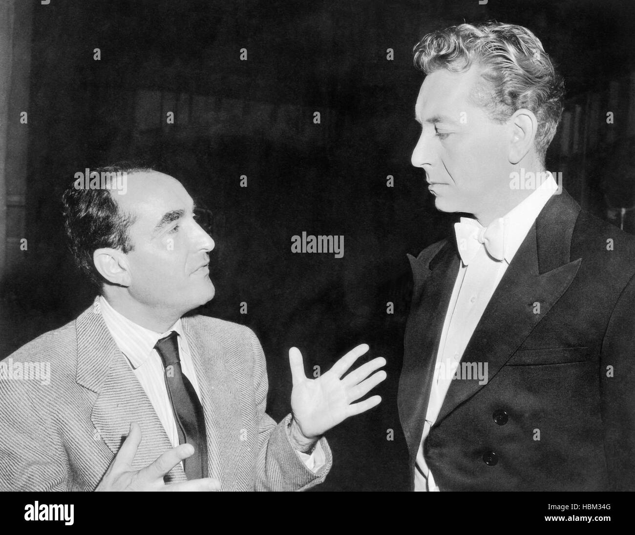 DECEPTION, director Irving Rapper, Paul Henreid, on set, 1946 Stock ...