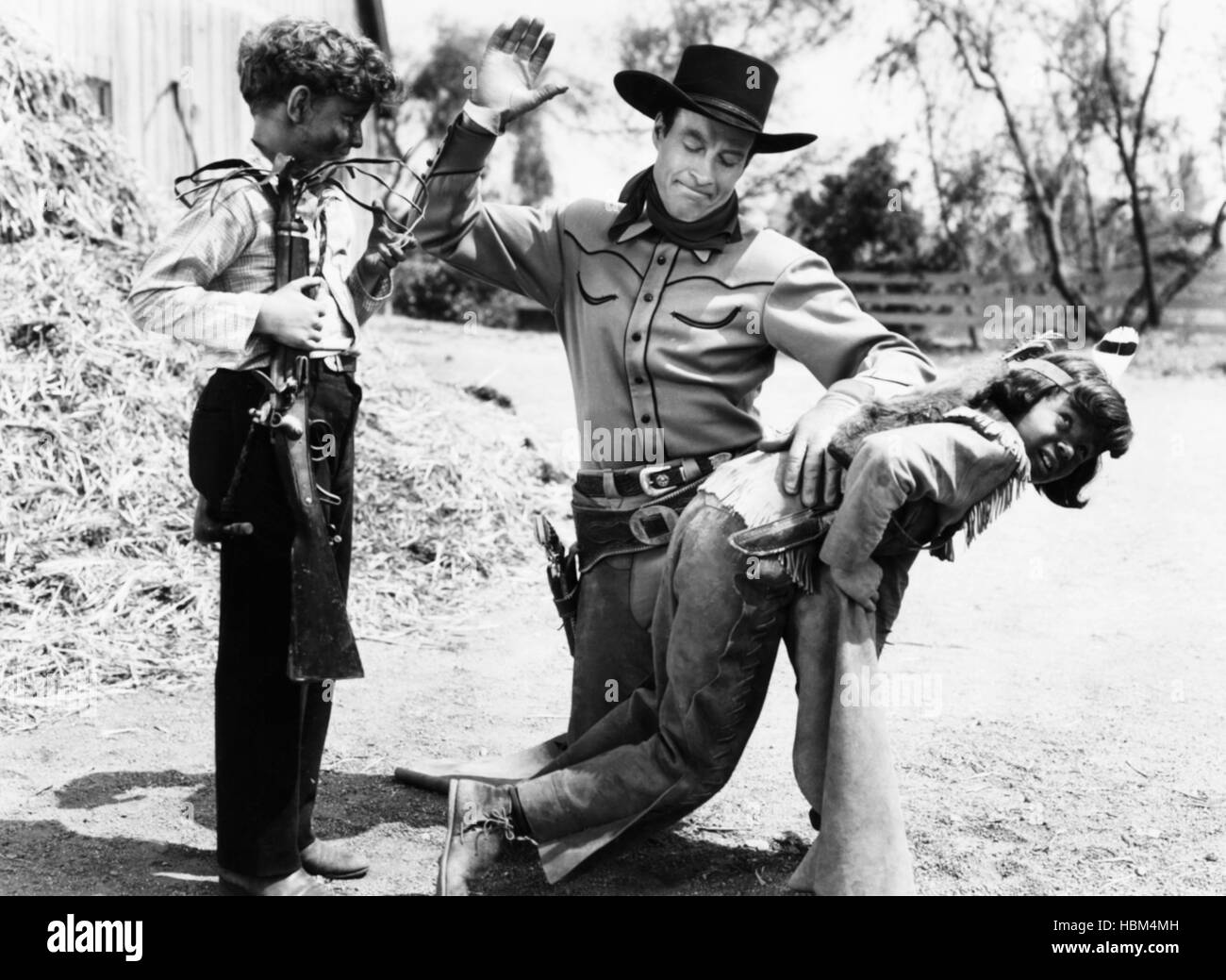 CHEYENNE WILDCAT, Bill Elliott, spanking Robert Blake, (billed as Bobby ...