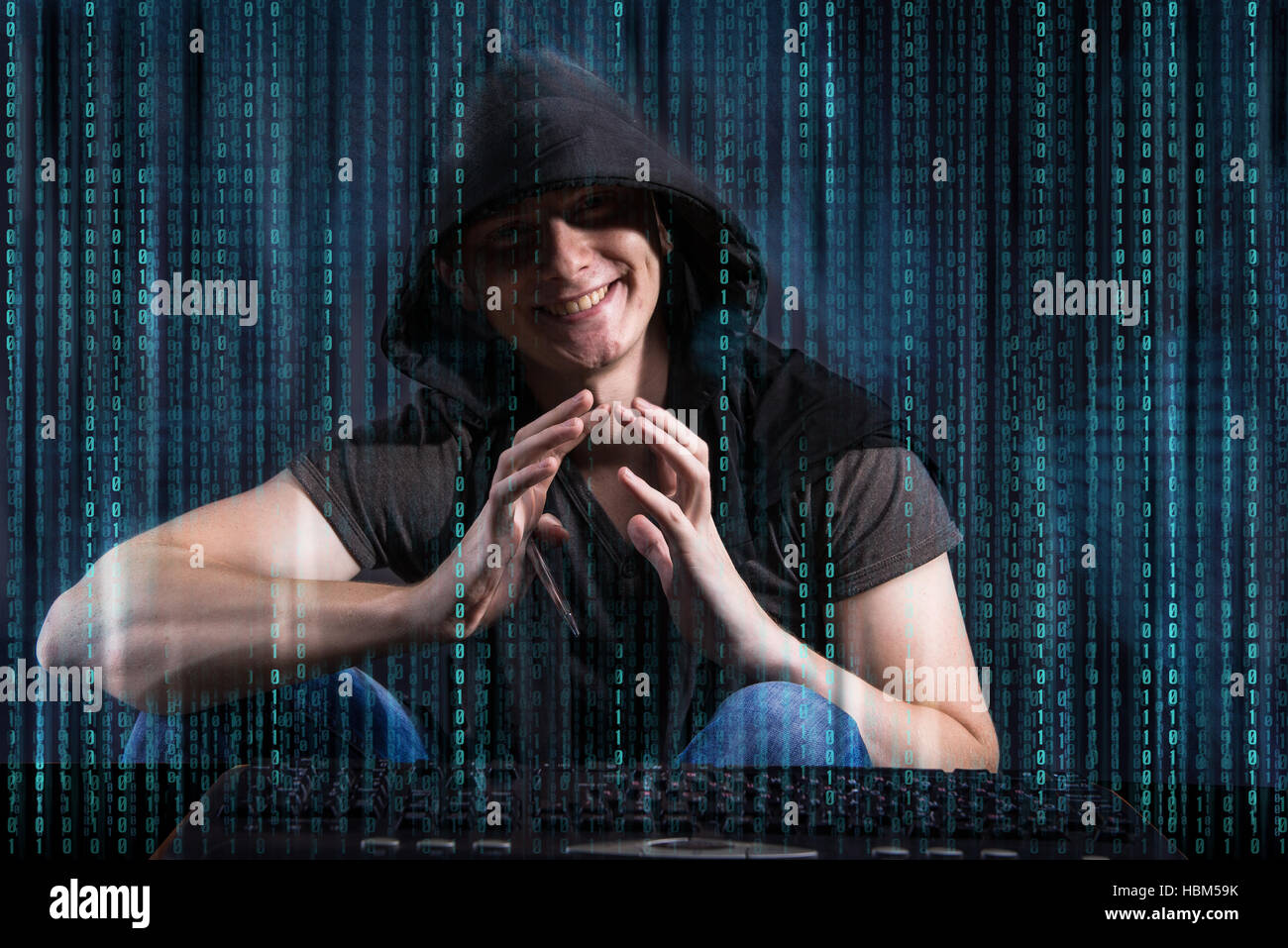 Young hacker in digital security concept Stock Photo - Alamy